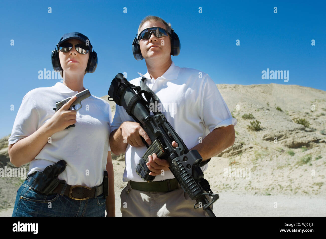 Man holding guns hi-res stock photography and images - Alamy