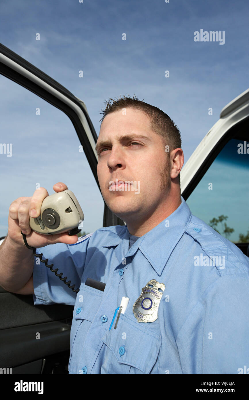 Paramedic using CB radio Stock Photo - Alamy