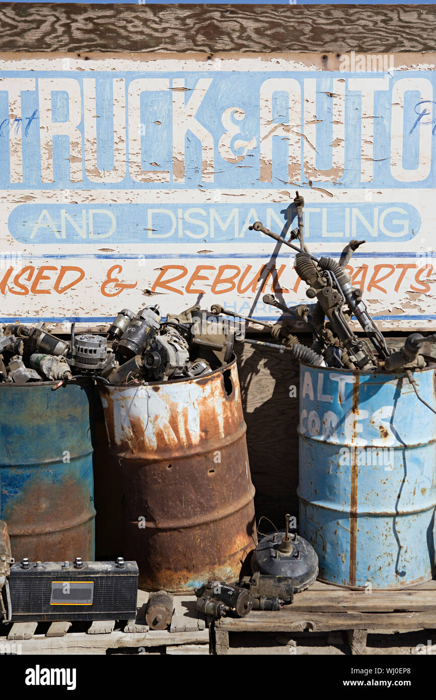 Rusty sign and barrels in junkyard Stock Photo - Alamy