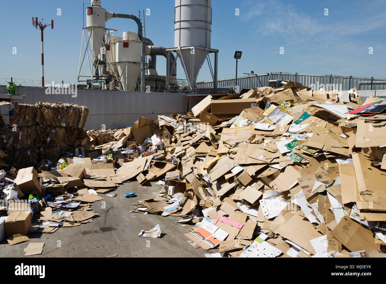 Pile of cardboard boxes in recycling centre Stock Photo - Alamy