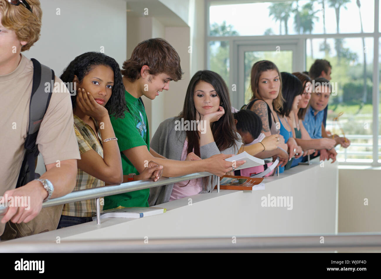 Students standing on balcony in school Stock Photo - Alamy