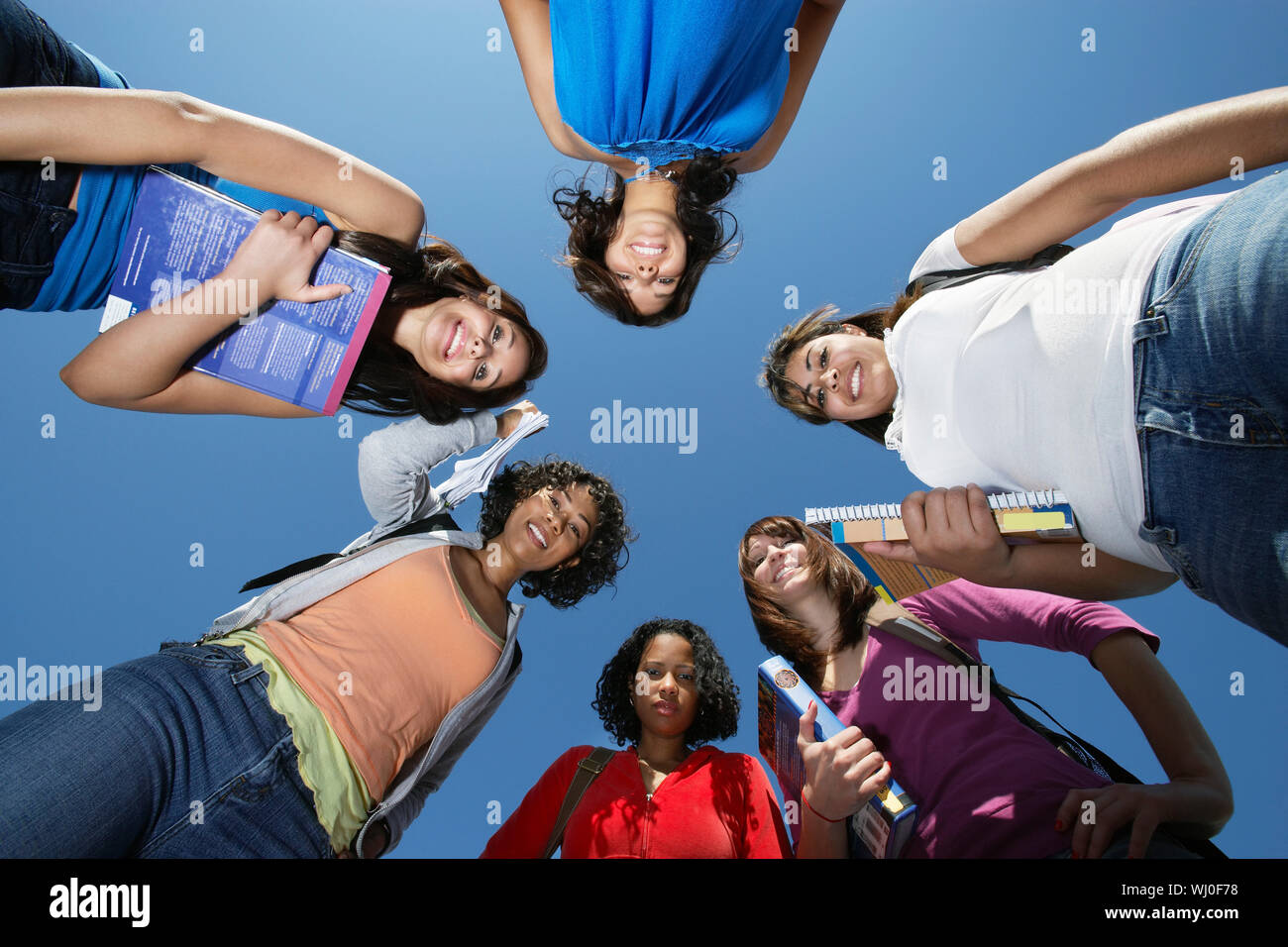 Female college students standing in circle, view from below Stock Photo ...