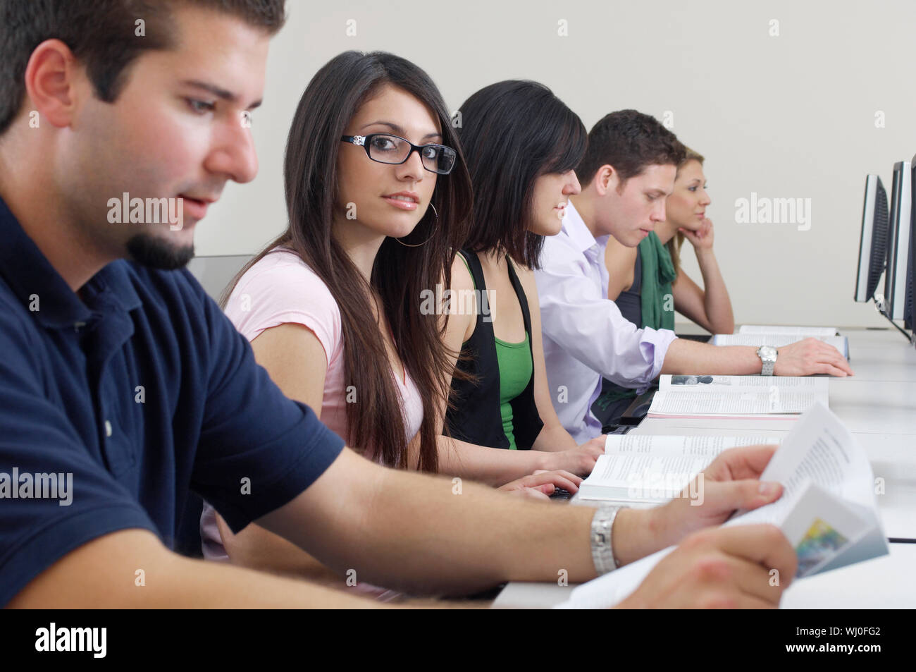 Students working in computer classroom Stock Photo - Alamy
