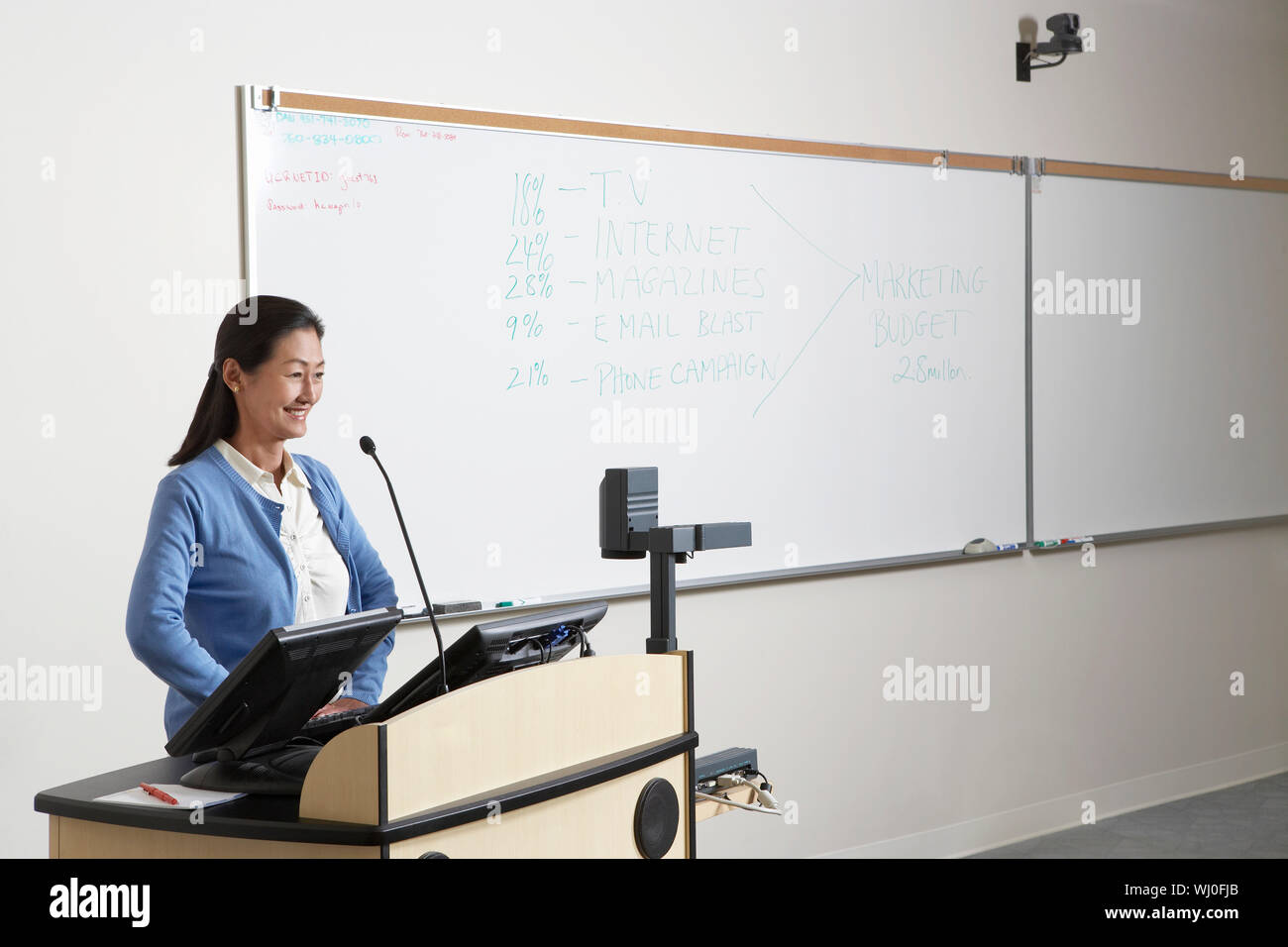 Female teacher in lecture theatre Stock Photo - Alamy