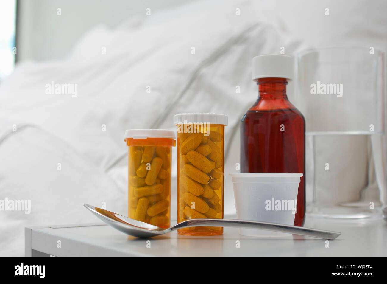 Medication on bedside table, close-up Stock Photo - Alamy