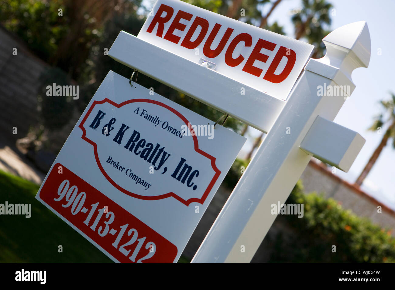 Real Estate Sign Advertising Reduced Price Stock Photo - Alamy