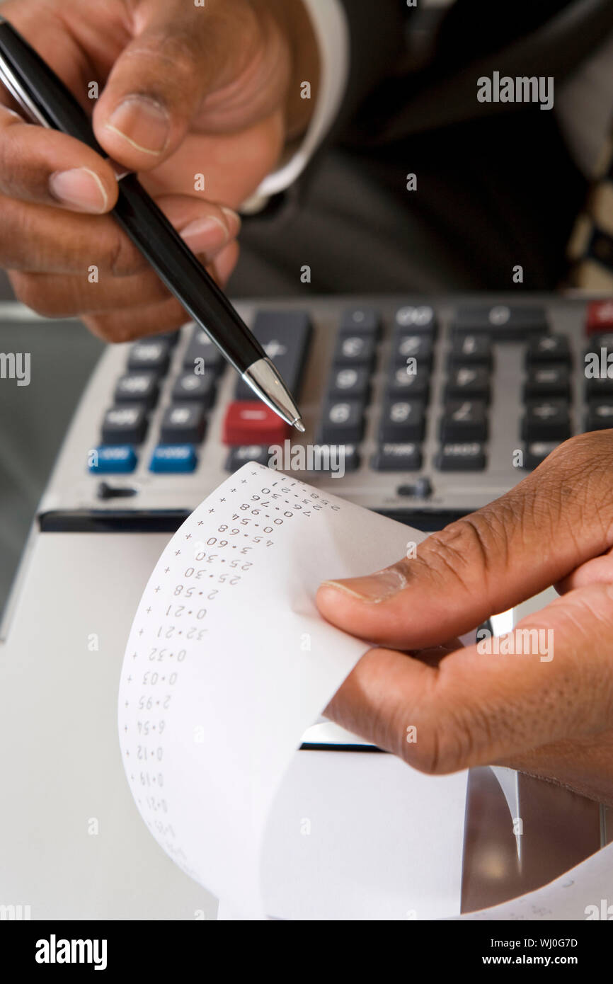 Accountant Reading Adding Machine Tape Stock Photo - Alamy