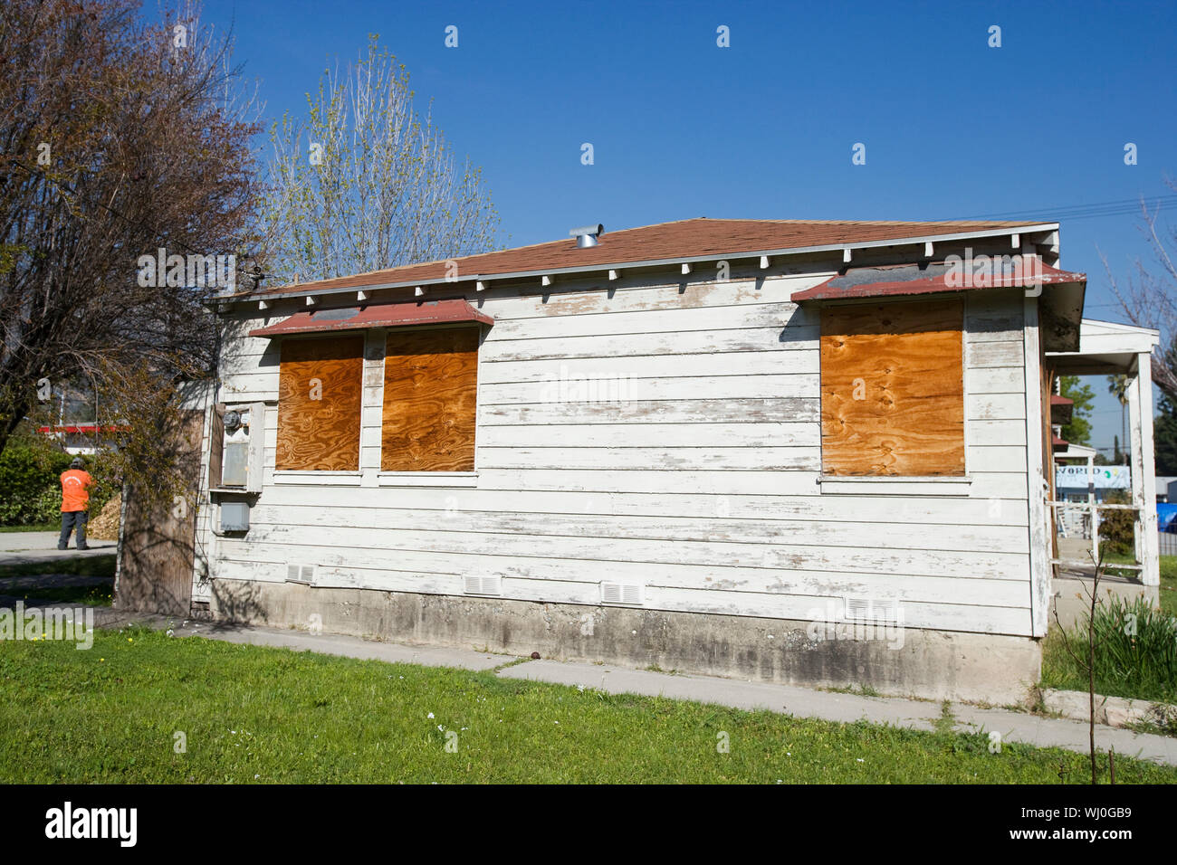Abandoned House With Boarded Up Windows Stock Photo - Alamy