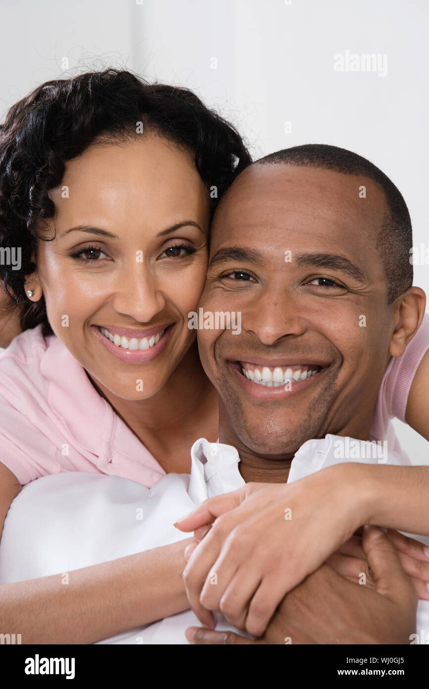 Closeup Portrait Of An African American Couple Smiling Together Stock