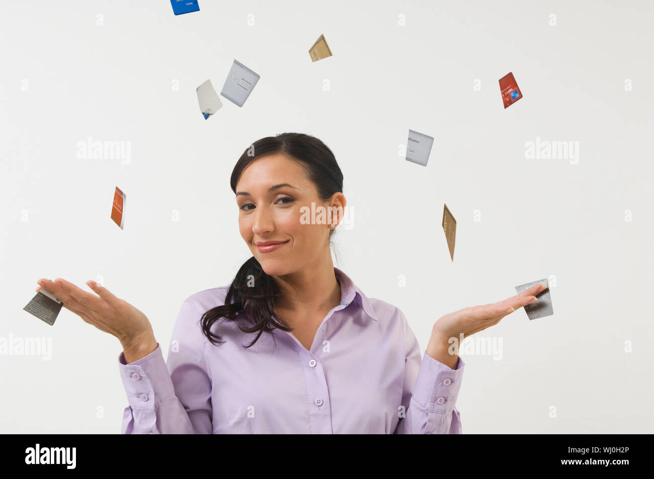 Female throwing cards hi-res stock photography and images - Alamy