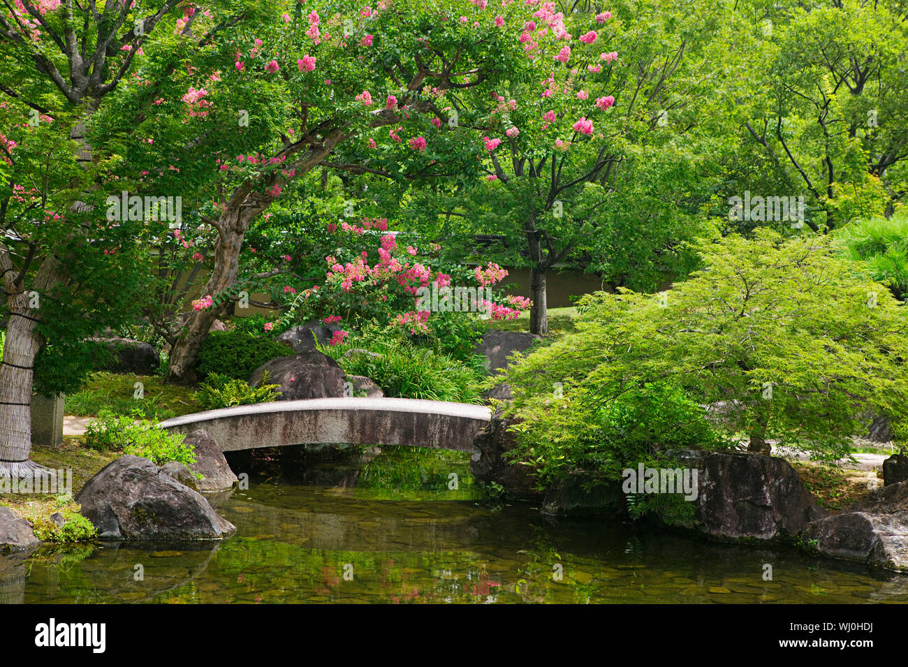 Japan, Himeji, Himeji Koko-en Gardens, stone bridge over stream Stock ...