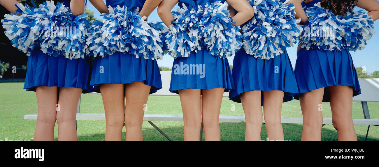 Five cheerleaders in row, back view, mid section Stock Photo - Alamy