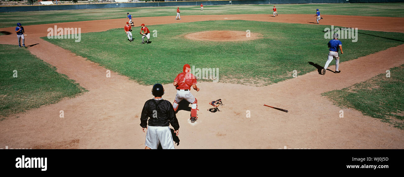 Baseball players on playing field Stock Photo - Alamy