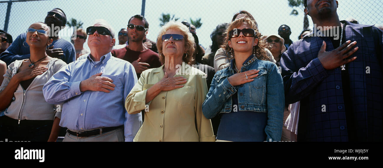 Crowd of people during national anthem, outdoors Stock Photo - Alamy