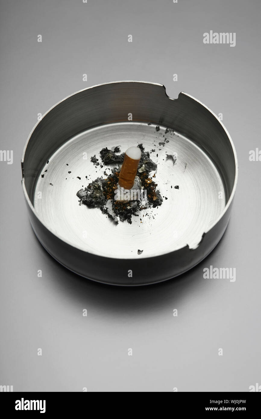 Cigarette in ashtray Stock Photo - Alamy