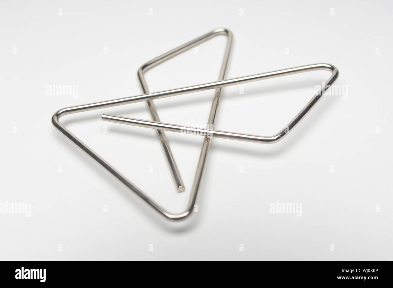 Paper clip on white background Stock Photo - Alamy