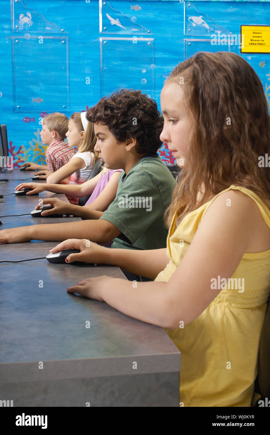 School children using computers in classroom Stock Photo - Alamy