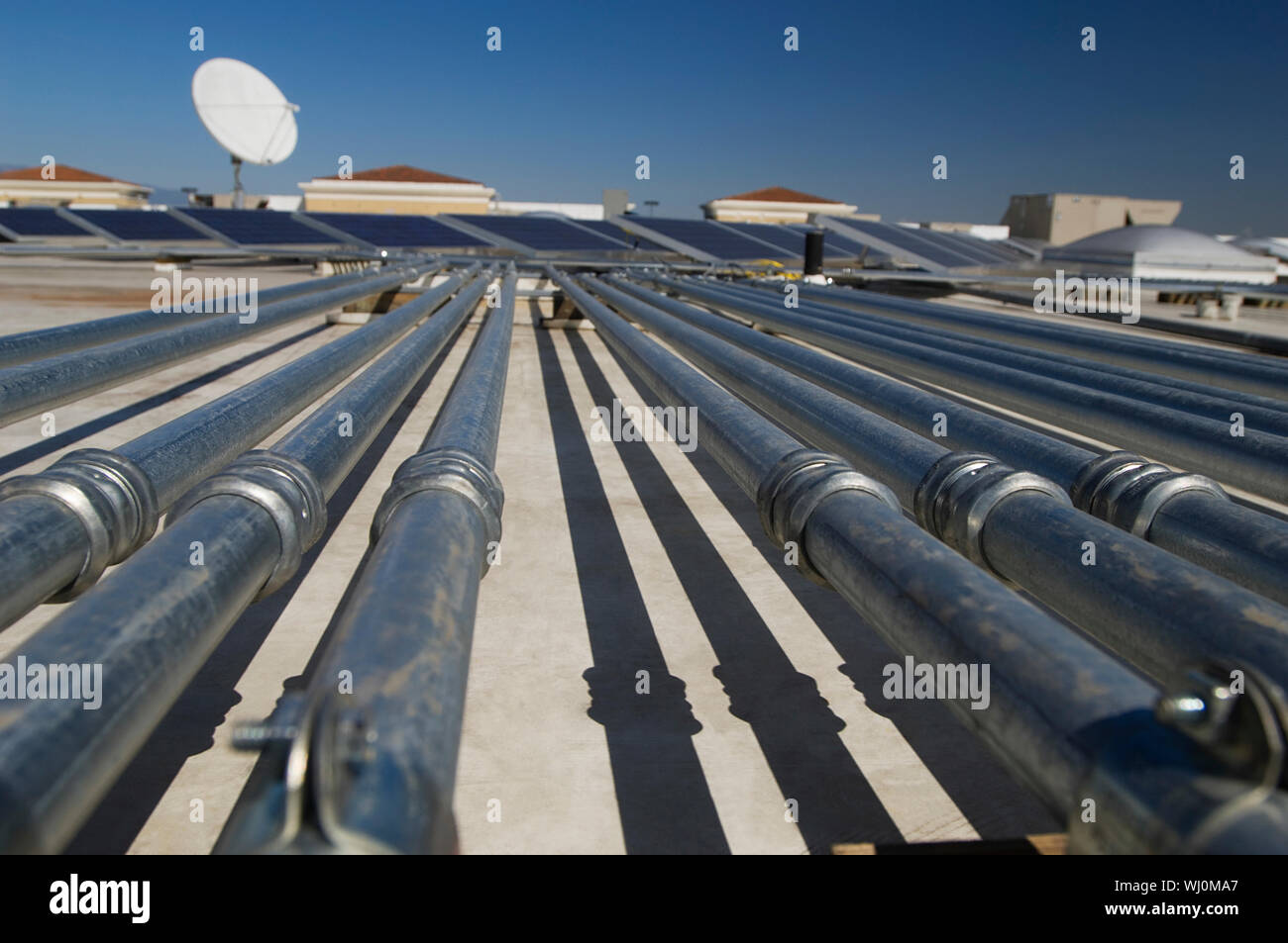 Pipes leading to solar panels at solar power plant Stock Photo - Alamy