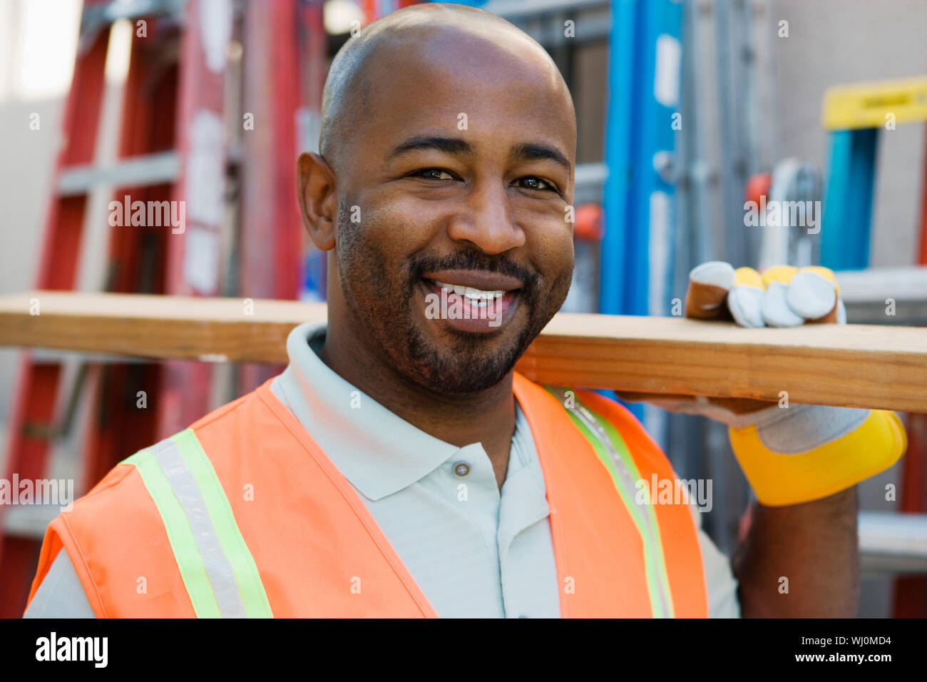 Workman with a Two-by-Four Stock Photo - Alamy