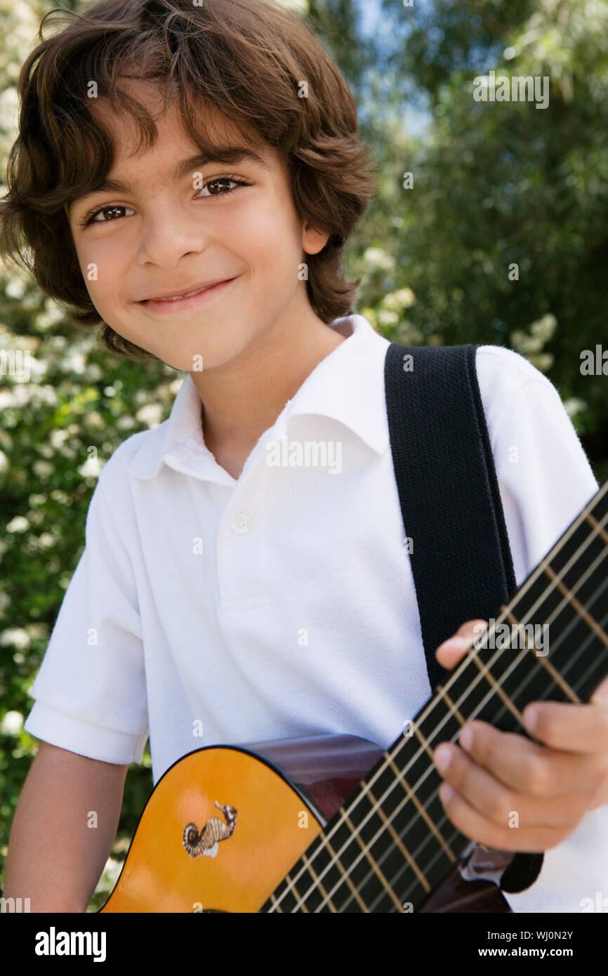 Little Boy Playing Guitar Stock Photo - Alamy