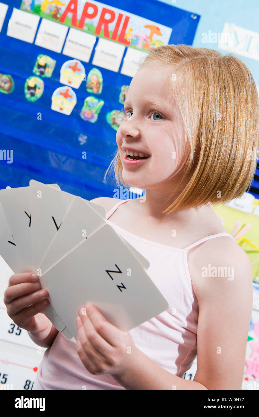 Elementary Student with Alphabet Flash Cards Stock Photo - Alamy