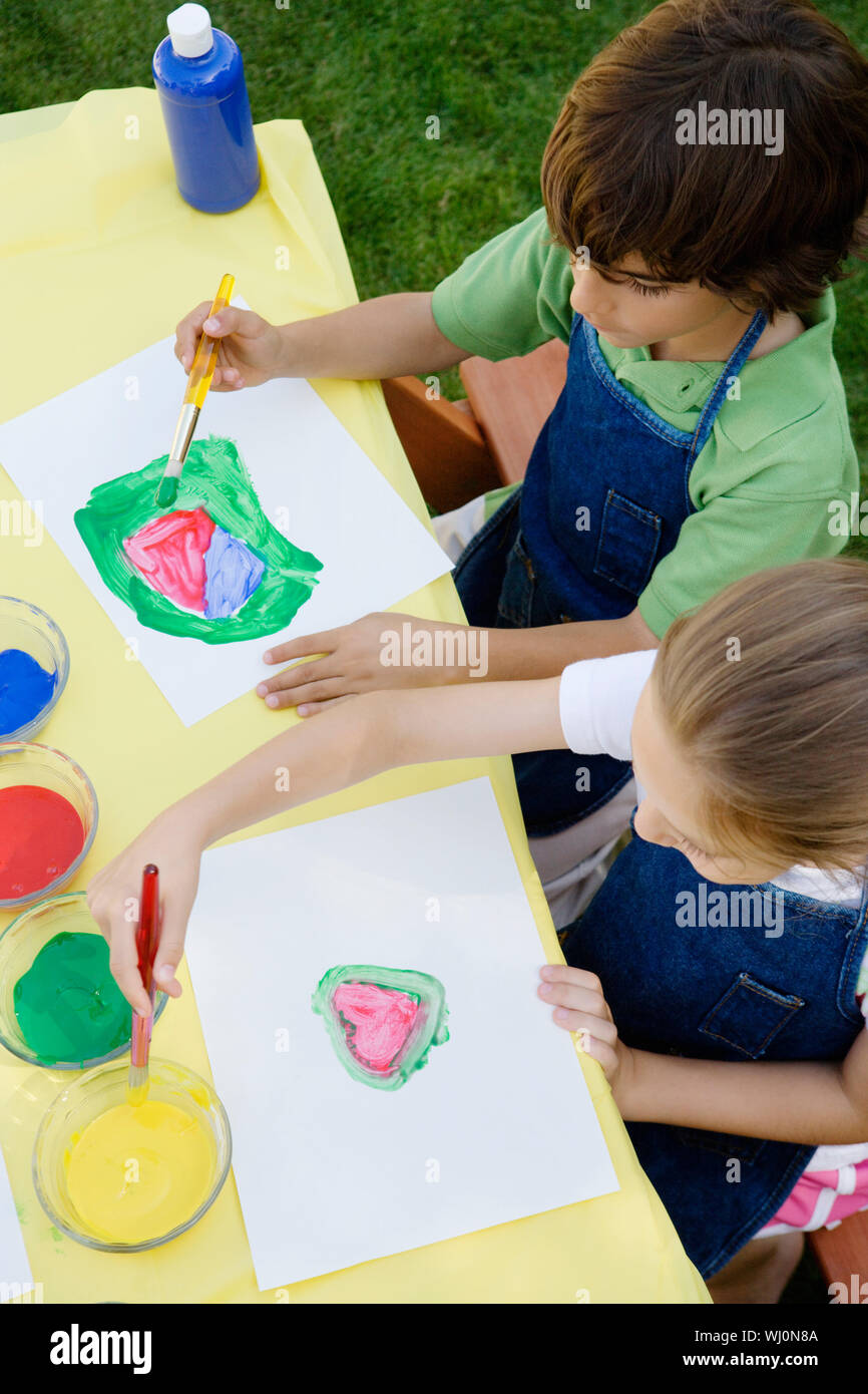 Kids Painting Outside Stock Photo - Alamy