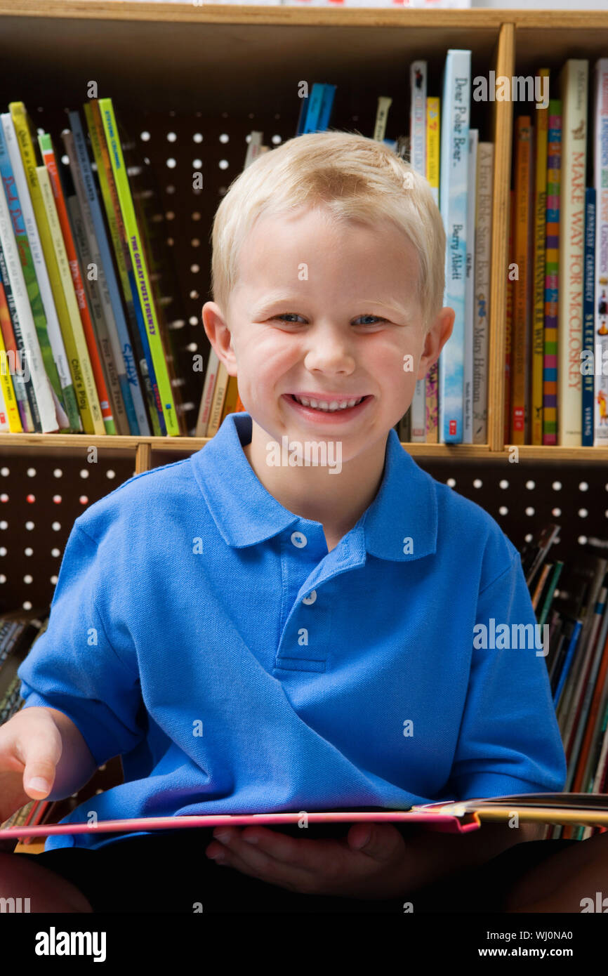 Little Boy Reading a Book Stock Photo - Alamy