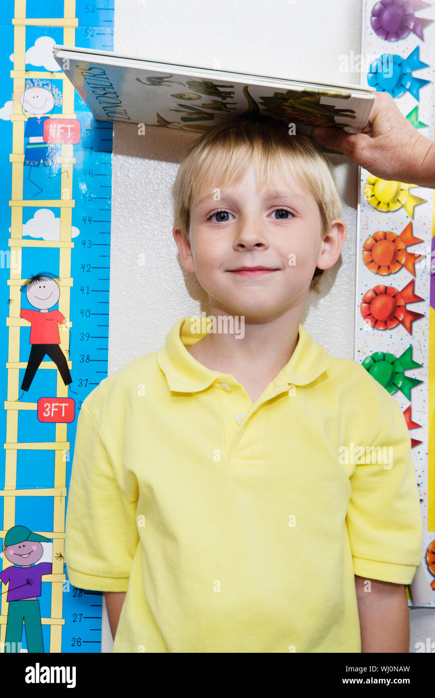 Boy Getting Height Measured Stock Photo - Alamy