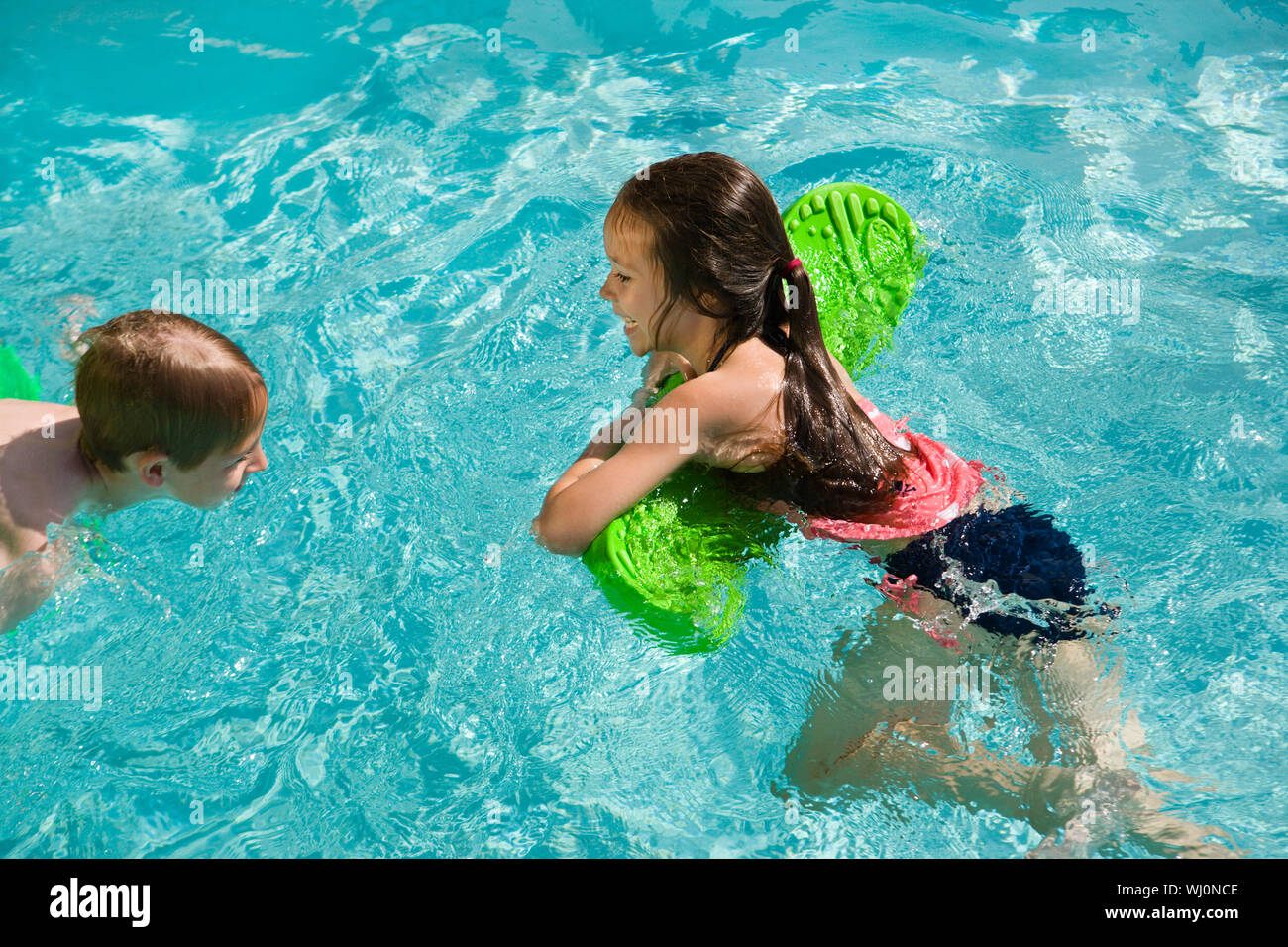 Youngster Floating In Pool High Resolution Stock Photography and Images ...