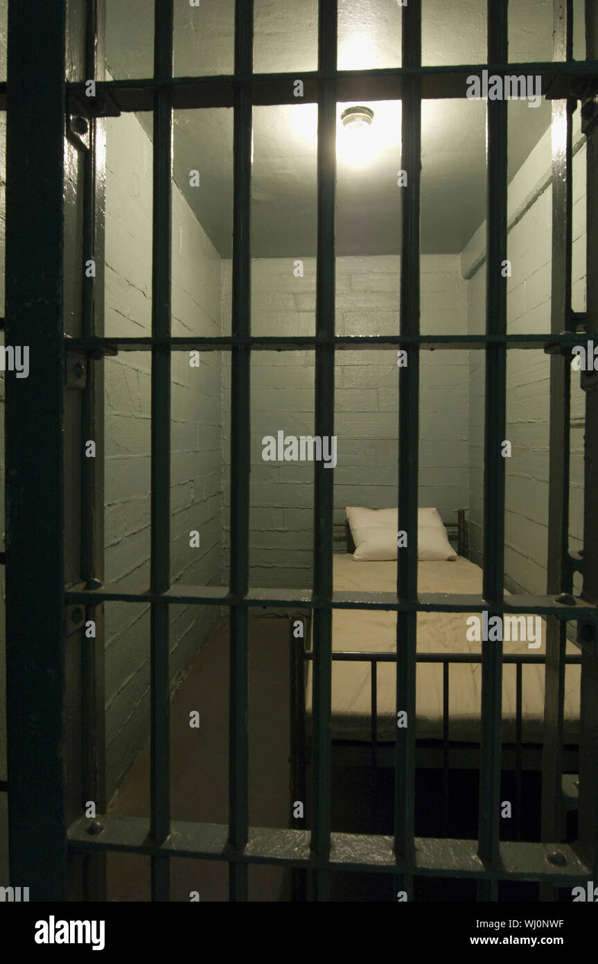 Interior of empty prison cell Stock Photo - Alamy