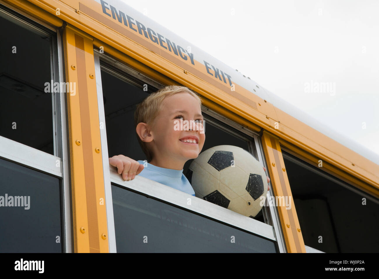 Boy on School Bus Stock Photo - Alamy
