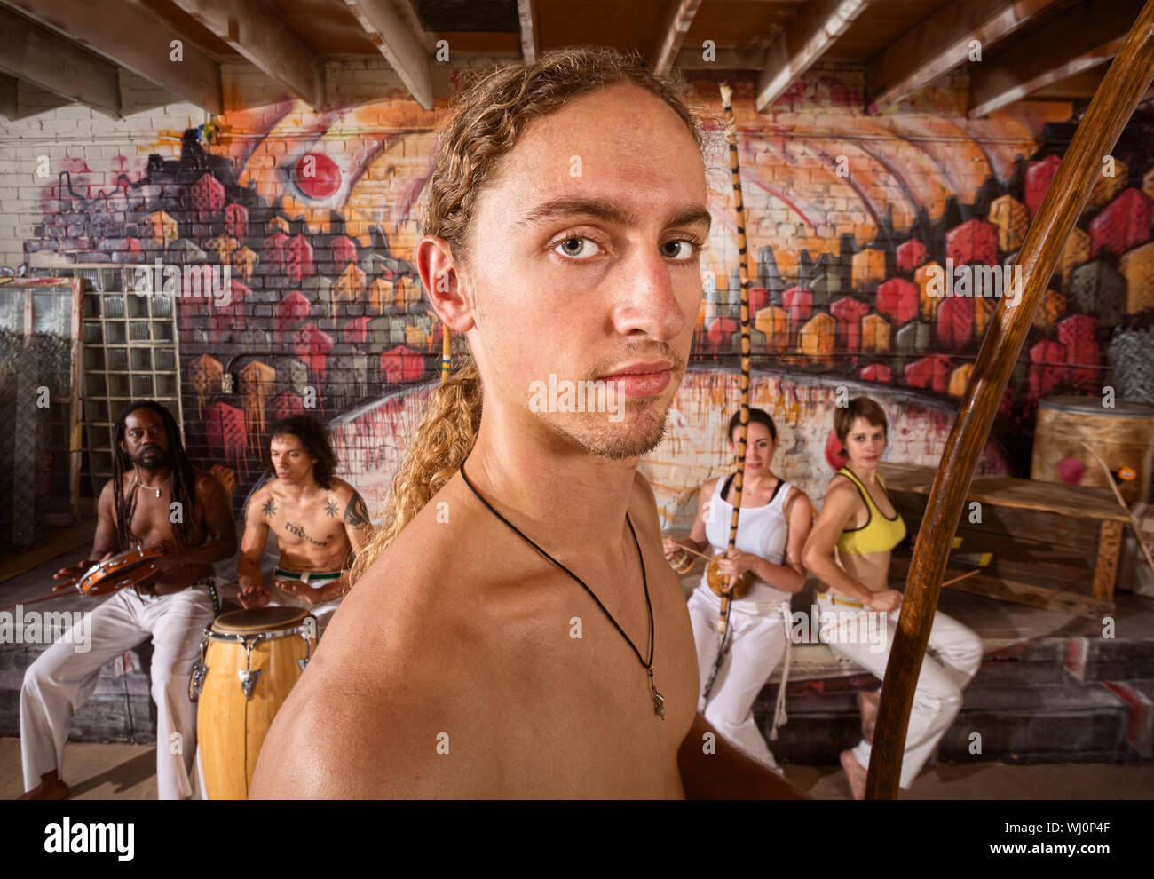 Close up of capoeira musician and group with instruments Stock Photo ...