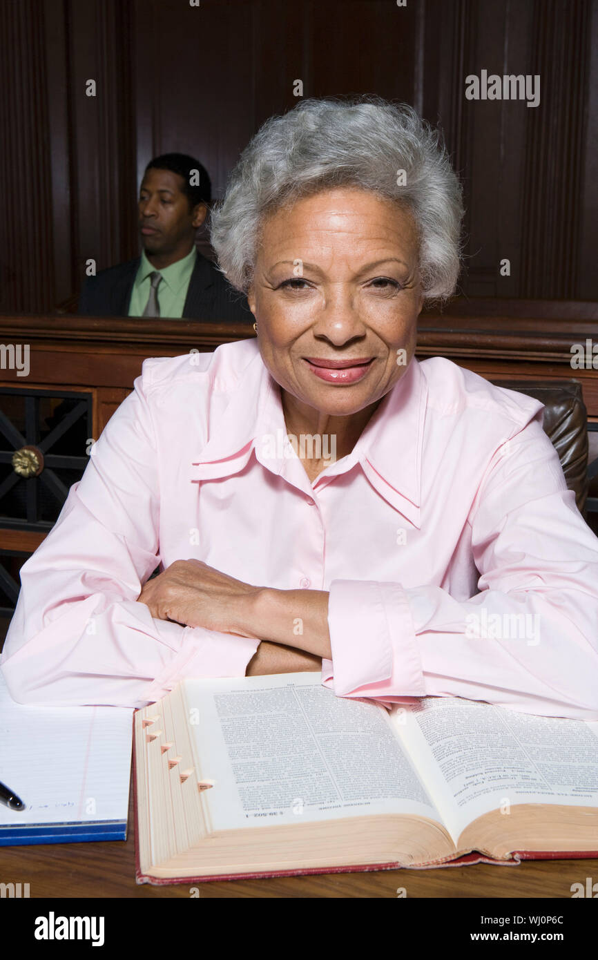 Female solicitor working in court, portrait Stock Photo - Alamy