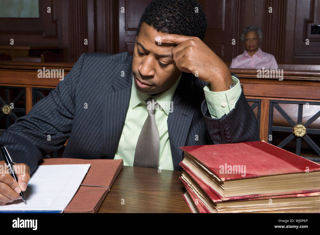 Man writing in court Stock Photo - Alamy