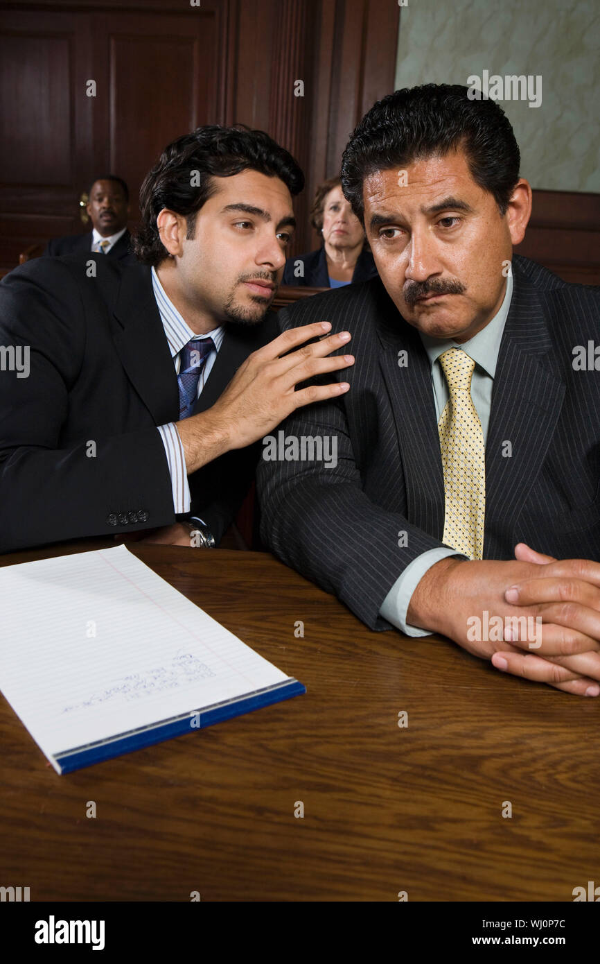 Two men sitting in court Stock Photo - Alamy