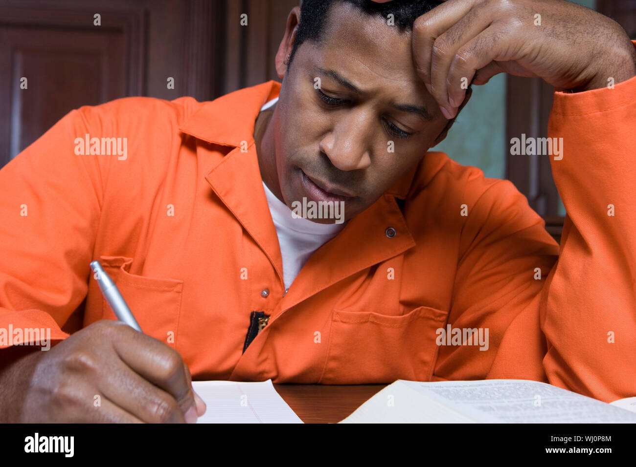 Criminal writing in court Stock Photo - Alamy