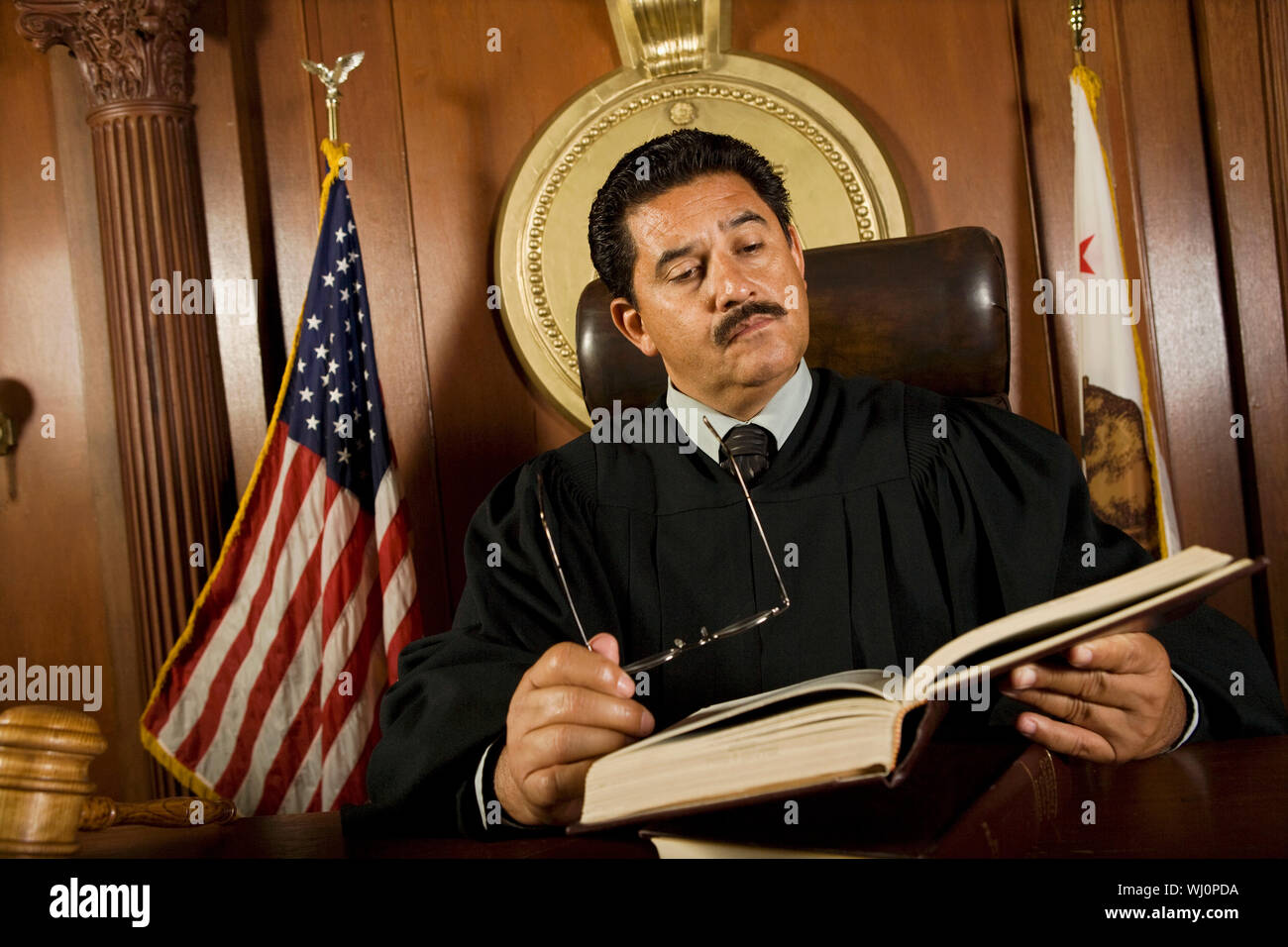 Judge reading in court Stock Photo - Alamy