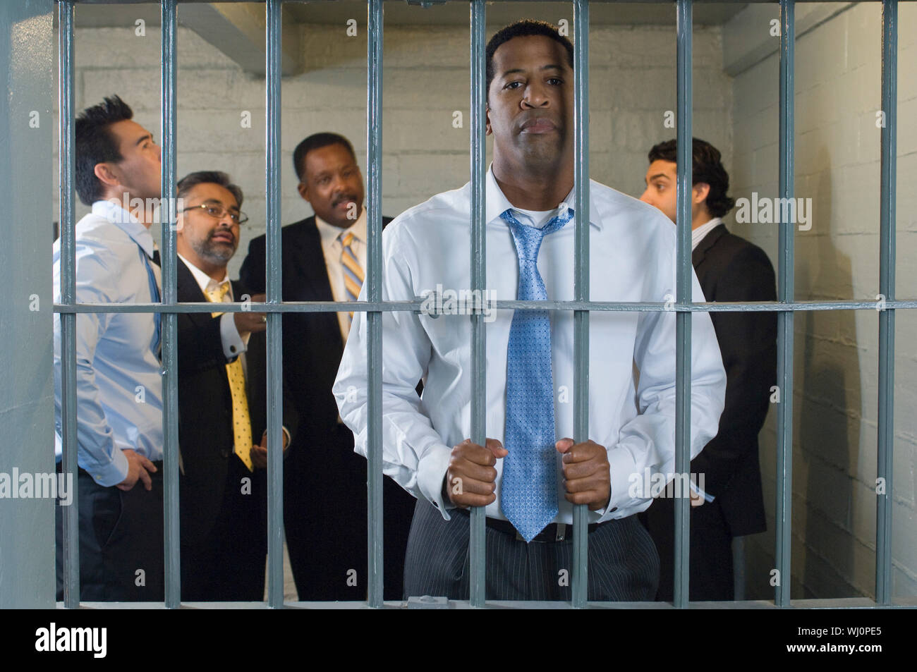 Group of men in prison cell Stock Photo - Alamy