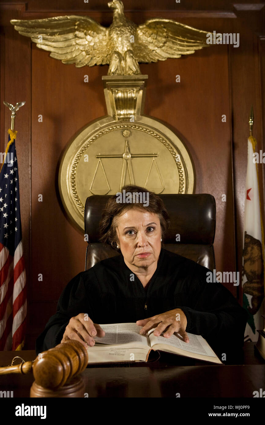 Judge sitting in court, portrait Stock Photo - Alamy