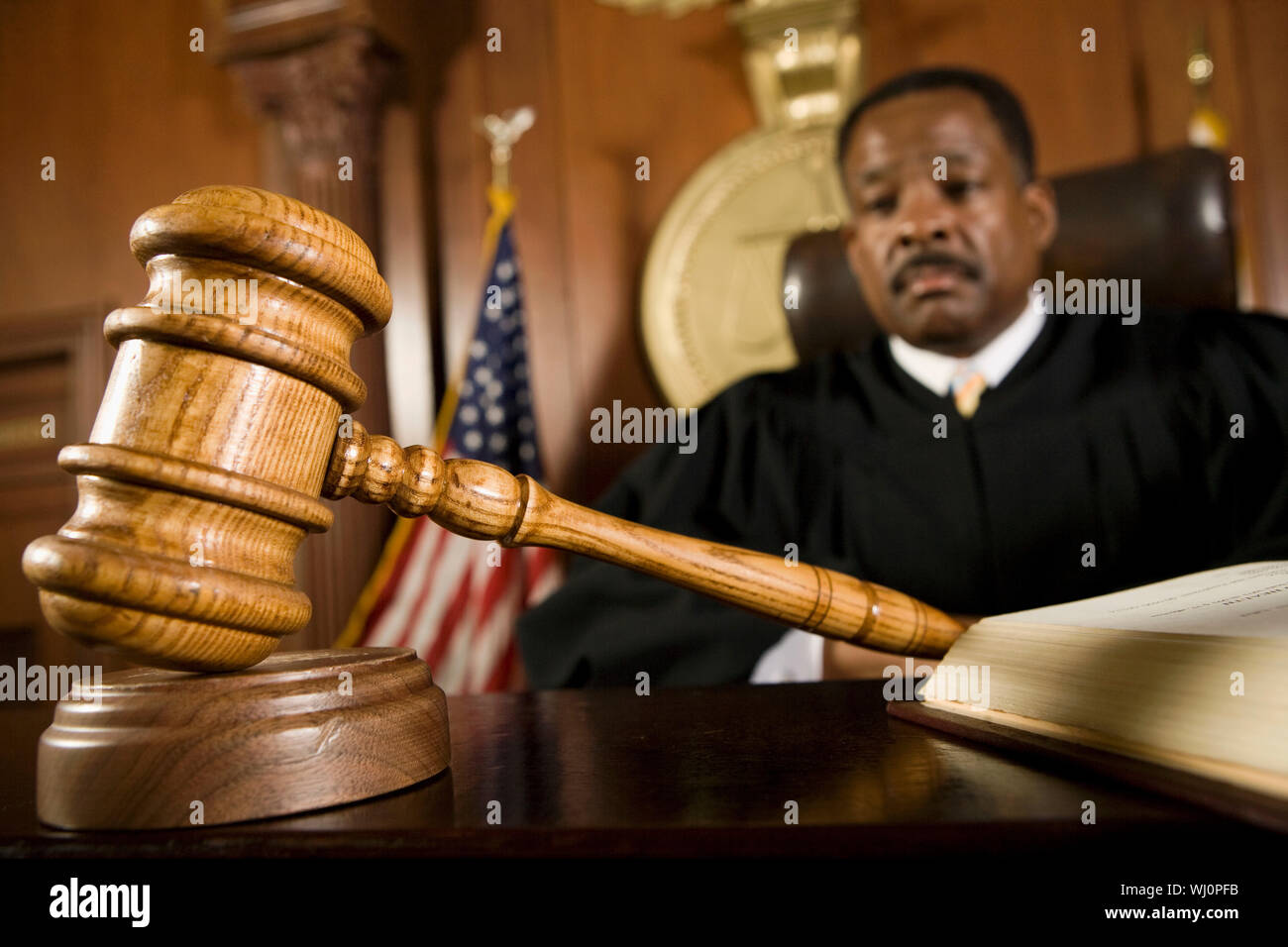 Gavel lying in front of a judge Stock Photo - Alamy