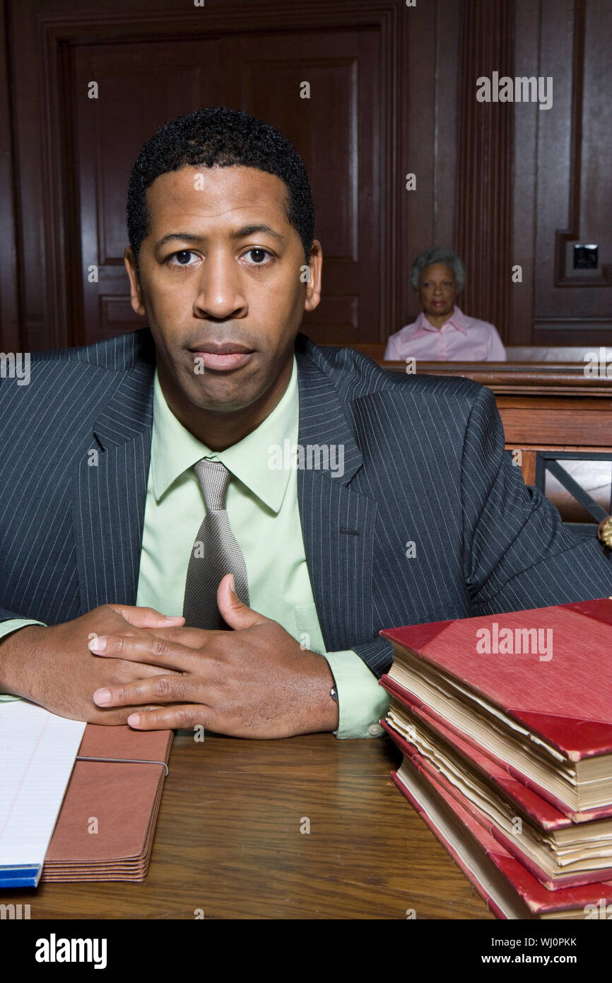 Man sitting in court, portrait Stock Photo - Alamy