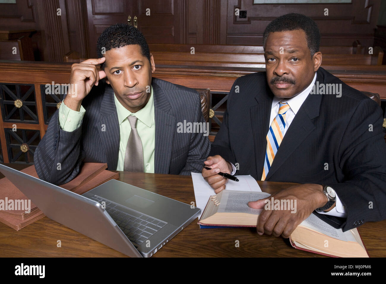 Two men sitting in court, portrait Stock Photo - Alamy