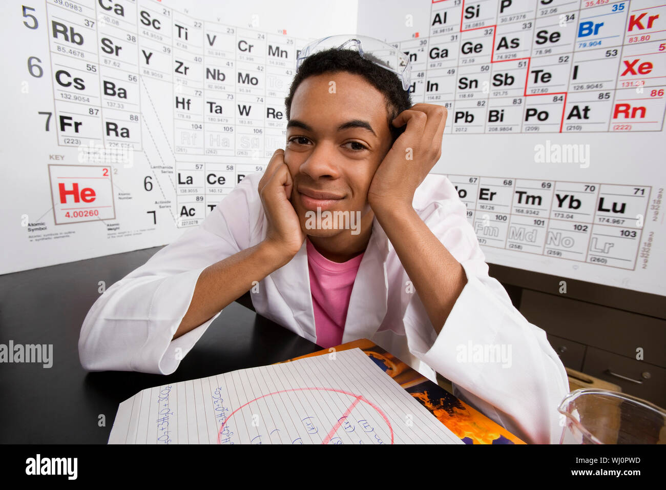 Portrait of a male student sitting in chemistry lab Stock Photo - Alamy