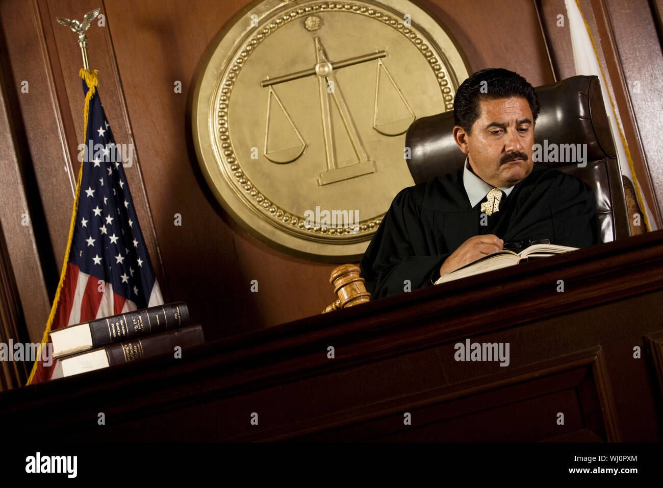 Judge reading in court Stock Photo - Alamy