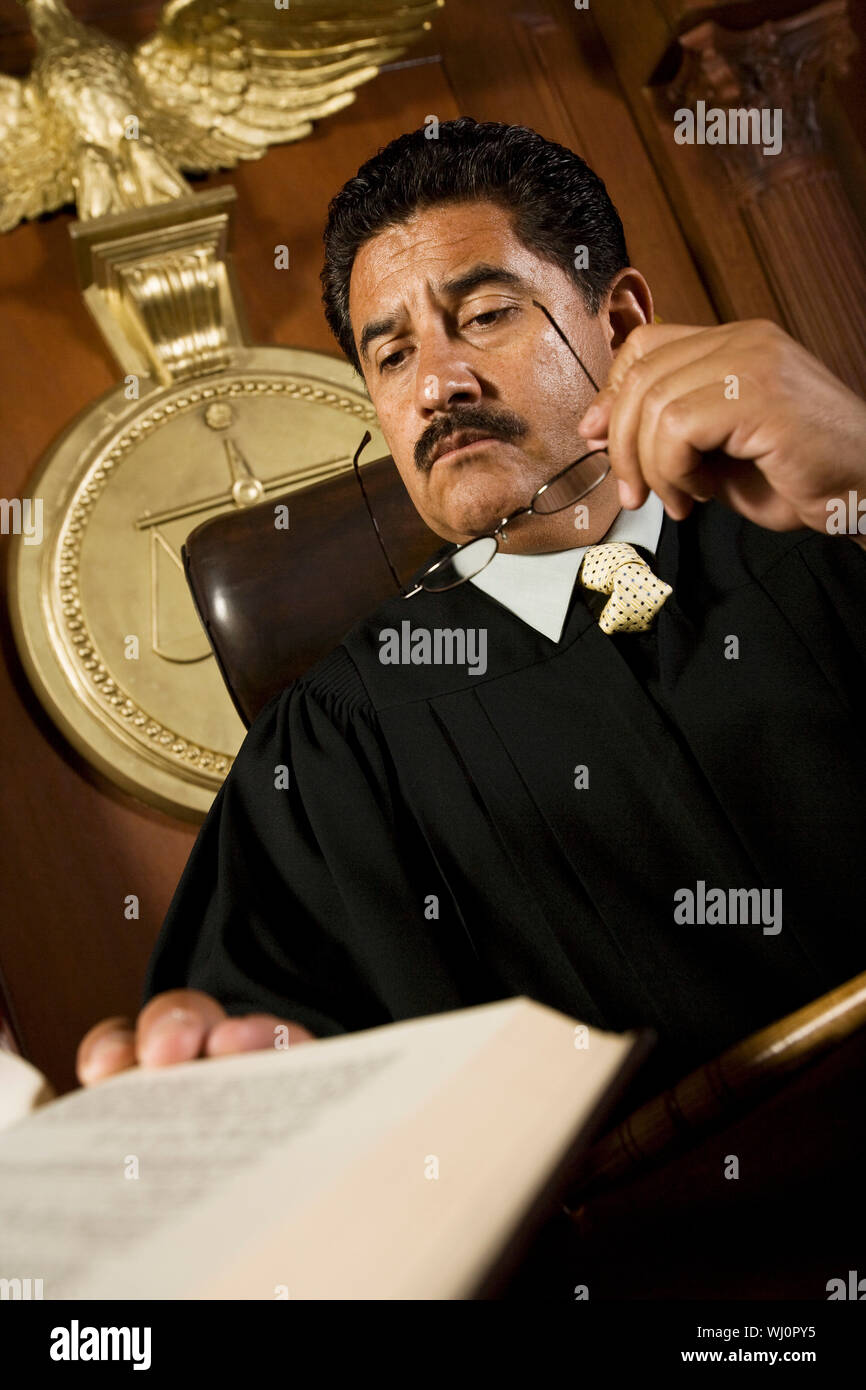 Judge reading in court Stock Photo - Alamy