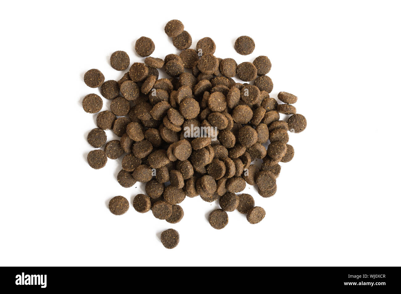 Heap of dog's food isolated on white background. Healthy pet's crunchy ...