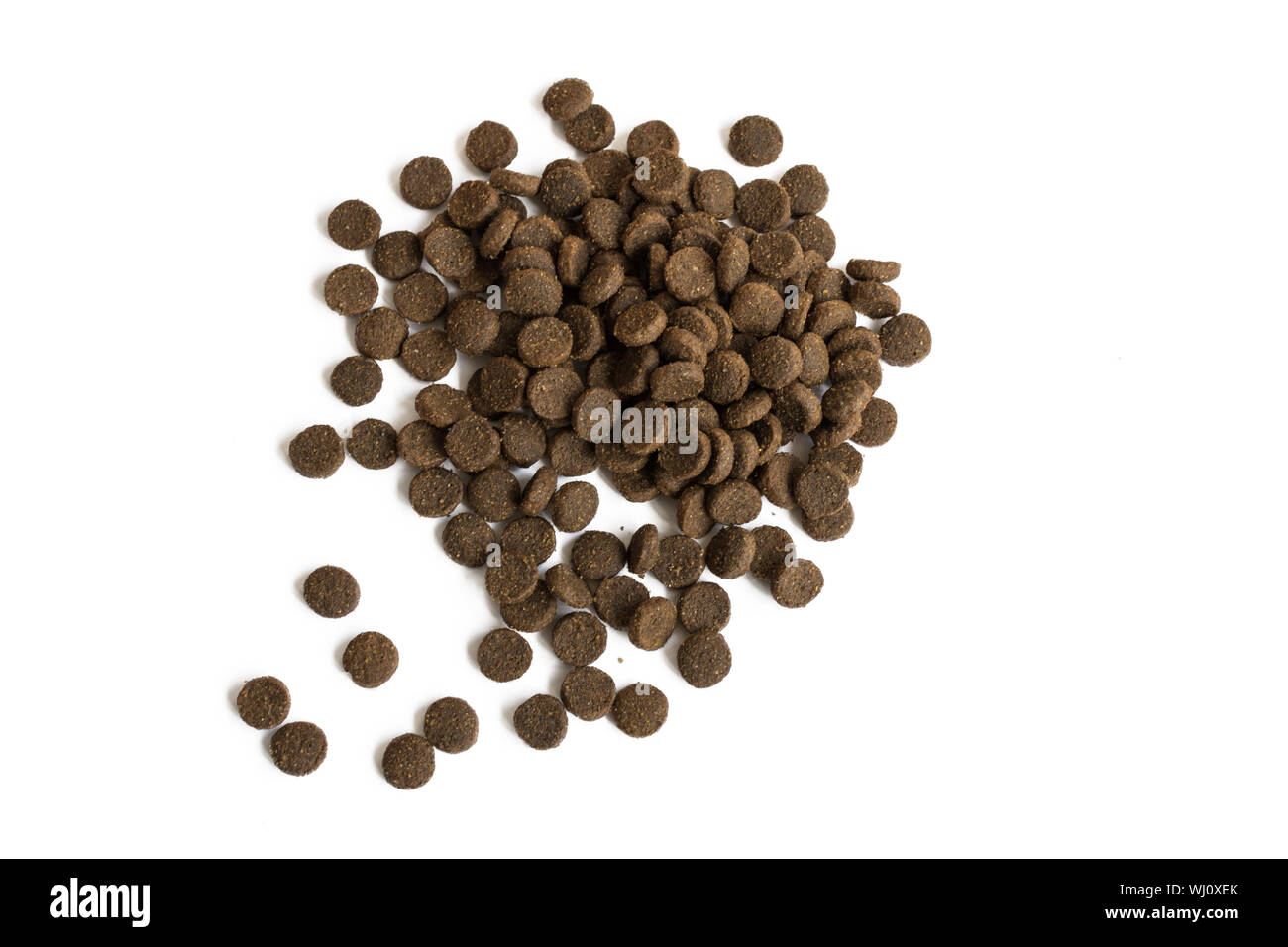 Heap of dog's food isolated on white background. Healthy pet's crunchy ...