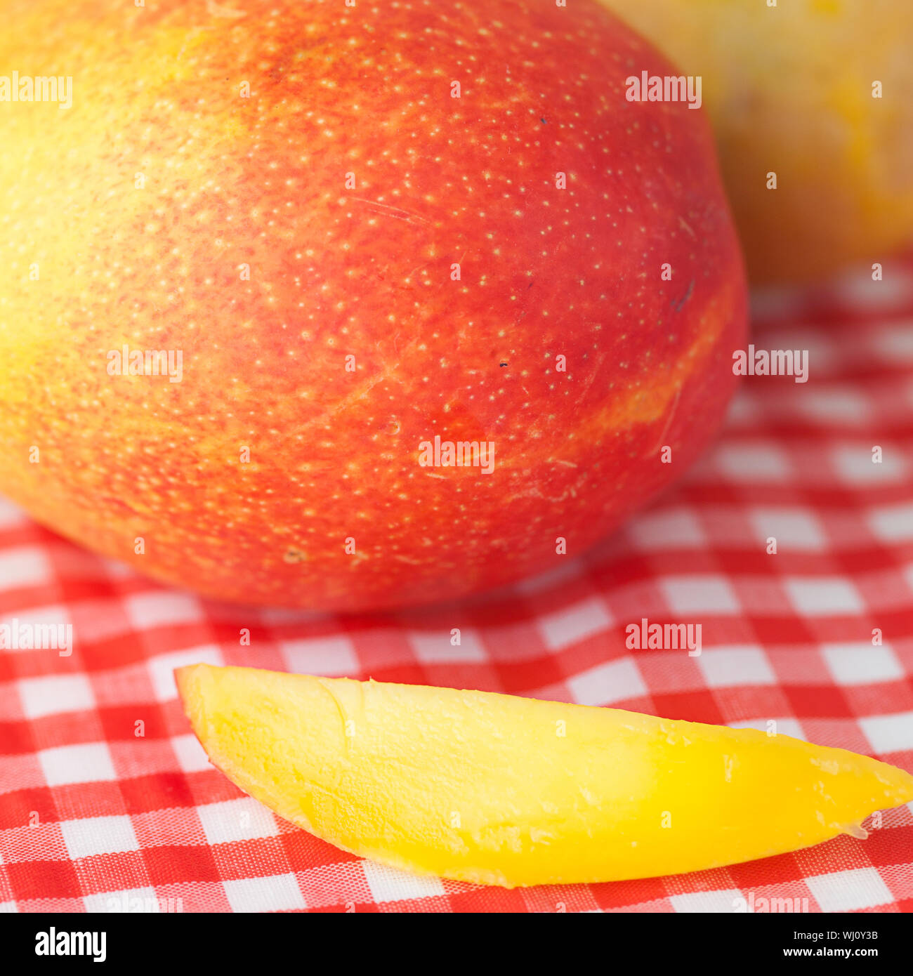 mango fruit on checkered fabric Stock Photo - Alamy