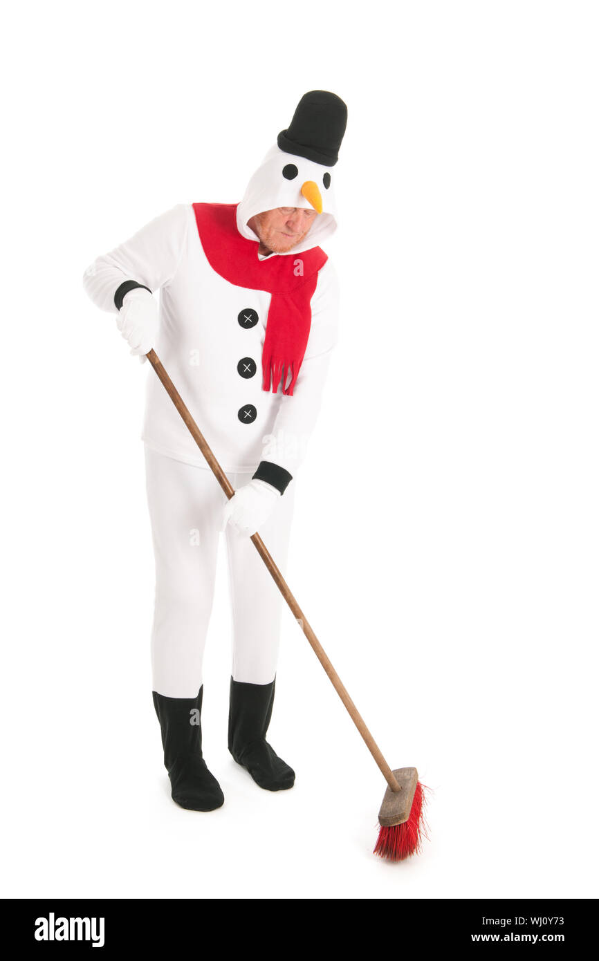Human snowman is cleaning the street with broom Stock Photo - Alamy