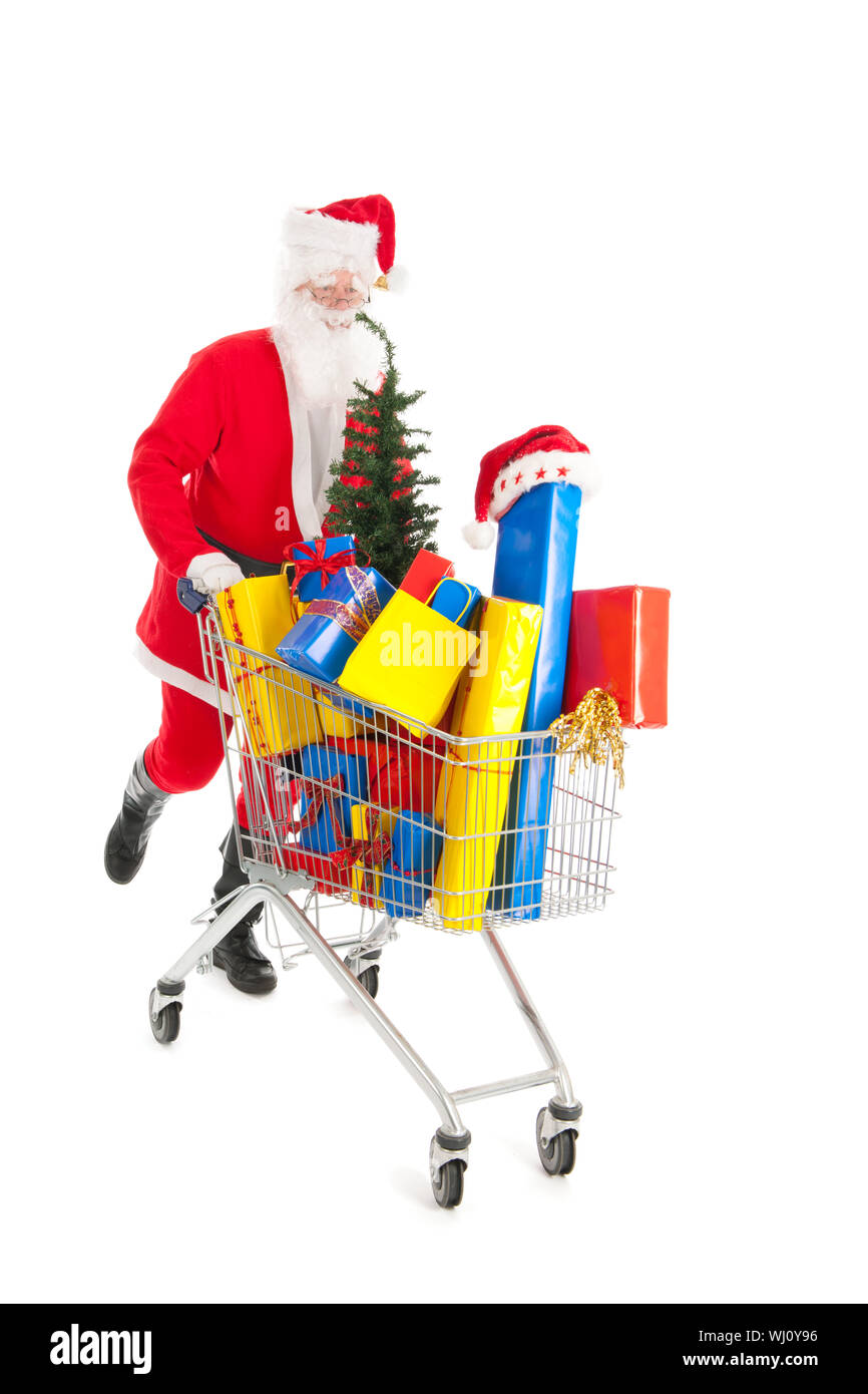 Santa Claus running with shopping cart full luxury presents and tree ...